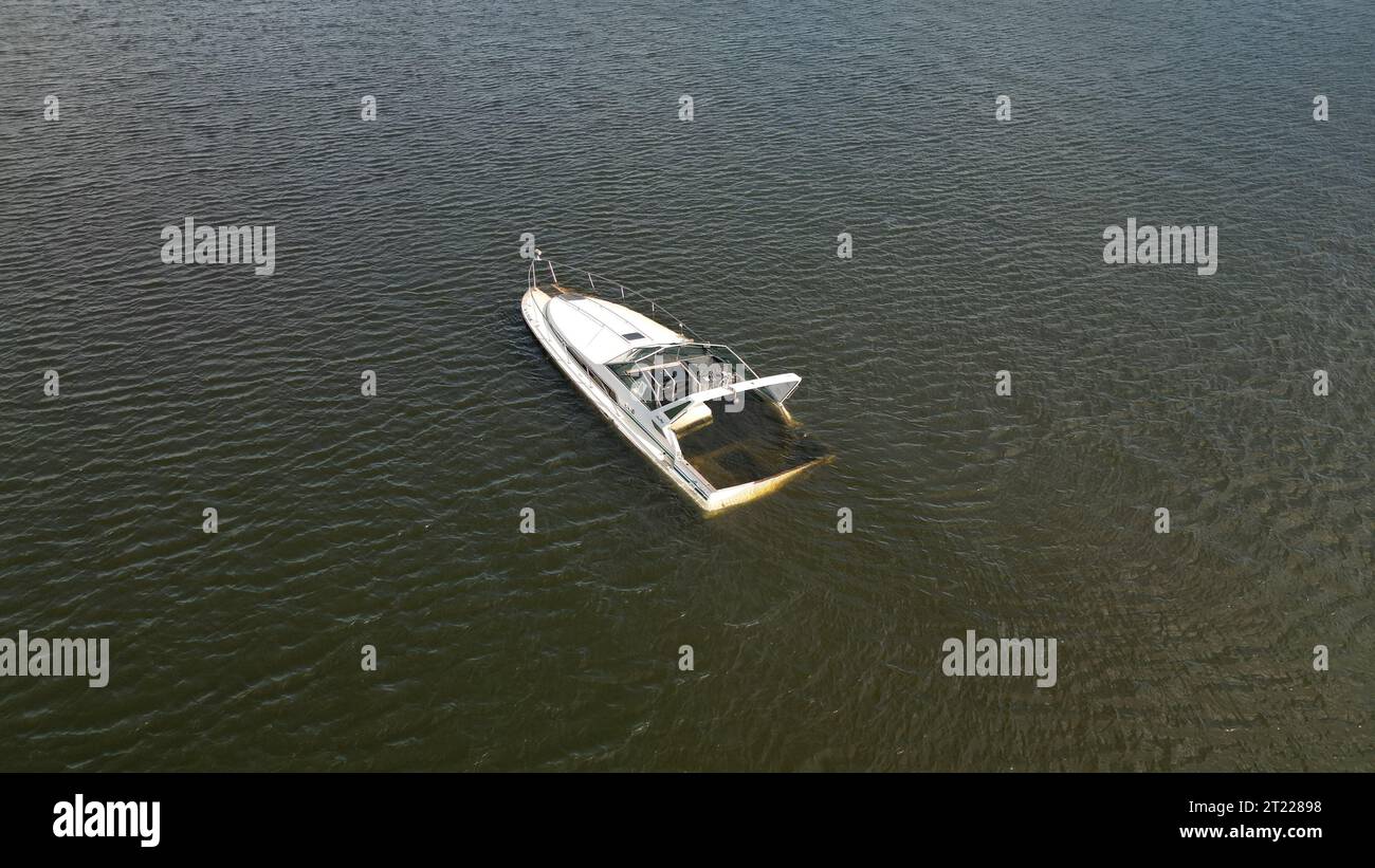 Aerial view of sinking ship. Partially submerged boat Stock Photo - Alamy