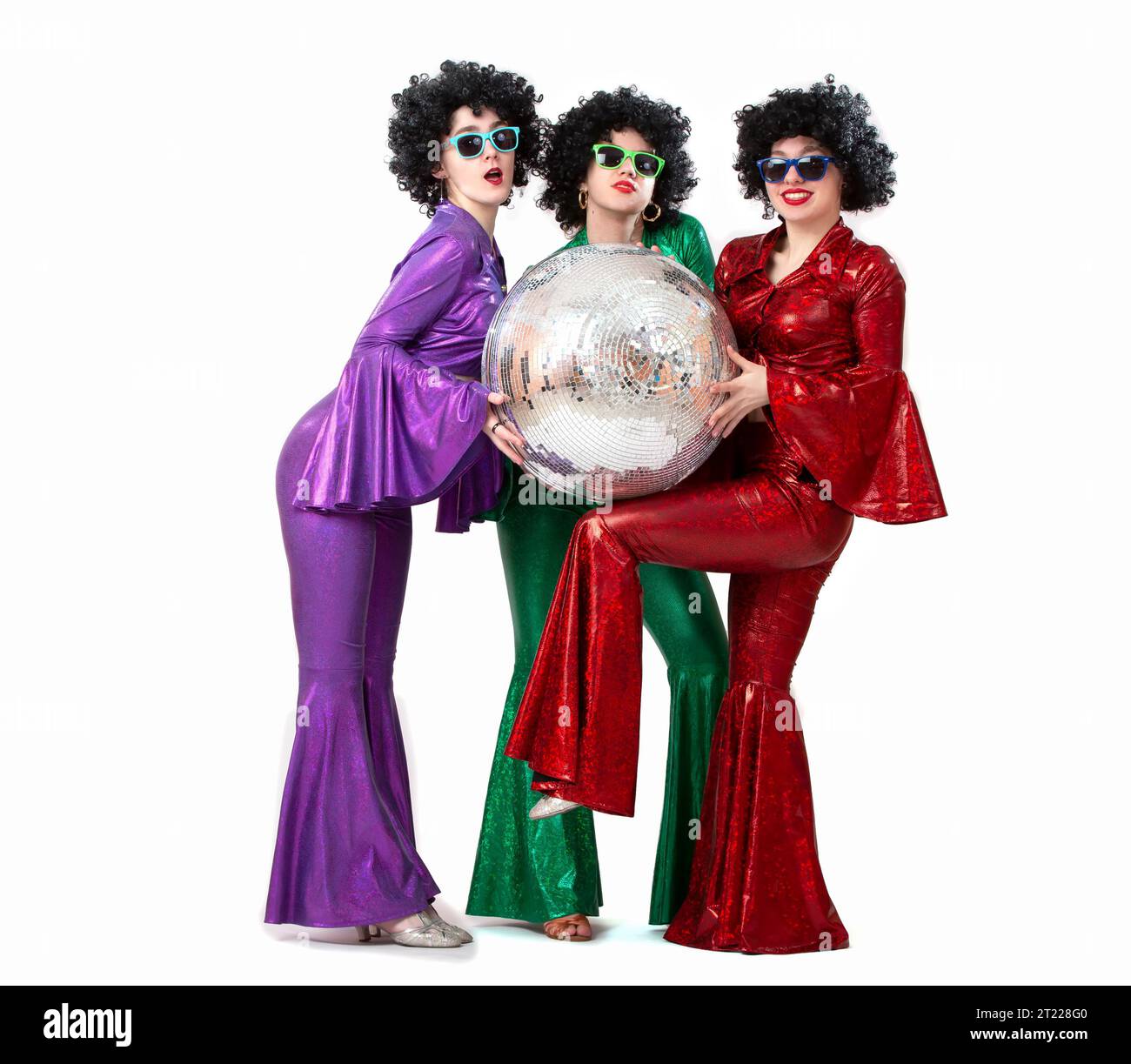 A group of girls with a disco ball in colorful costumes in the fashion ...