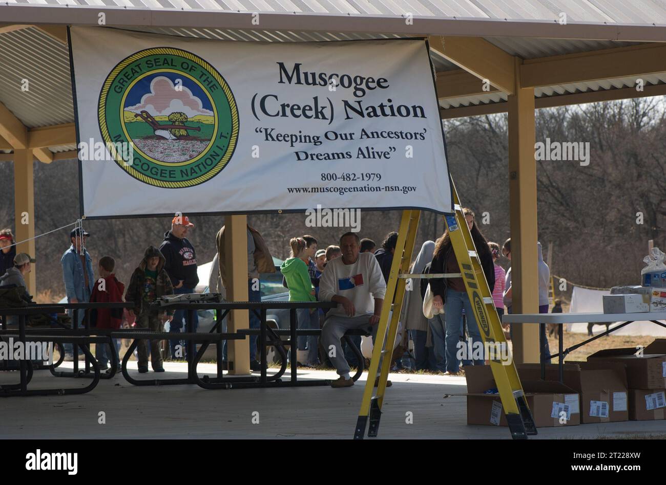 A view of the Muscogee (Creek) Nation banner hanging from a pavillion ...
