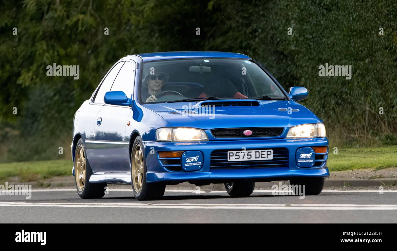 Bicester,Oxon.,UK - Oct 8th 2023: 1997 blue Subaru classic car driving ...