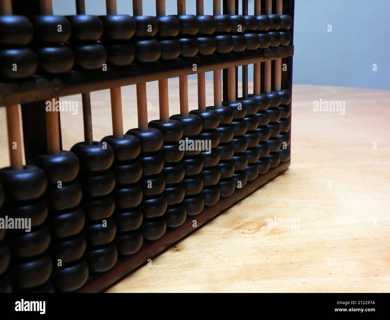 Chinese abacus on wooden table Stock Photo - Alamy