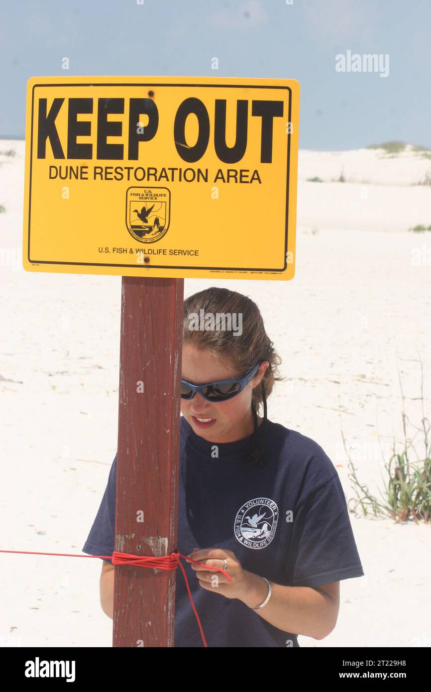U.S. Fish & Wildlife Service Volunteer Meredith Wilson closes off an ...