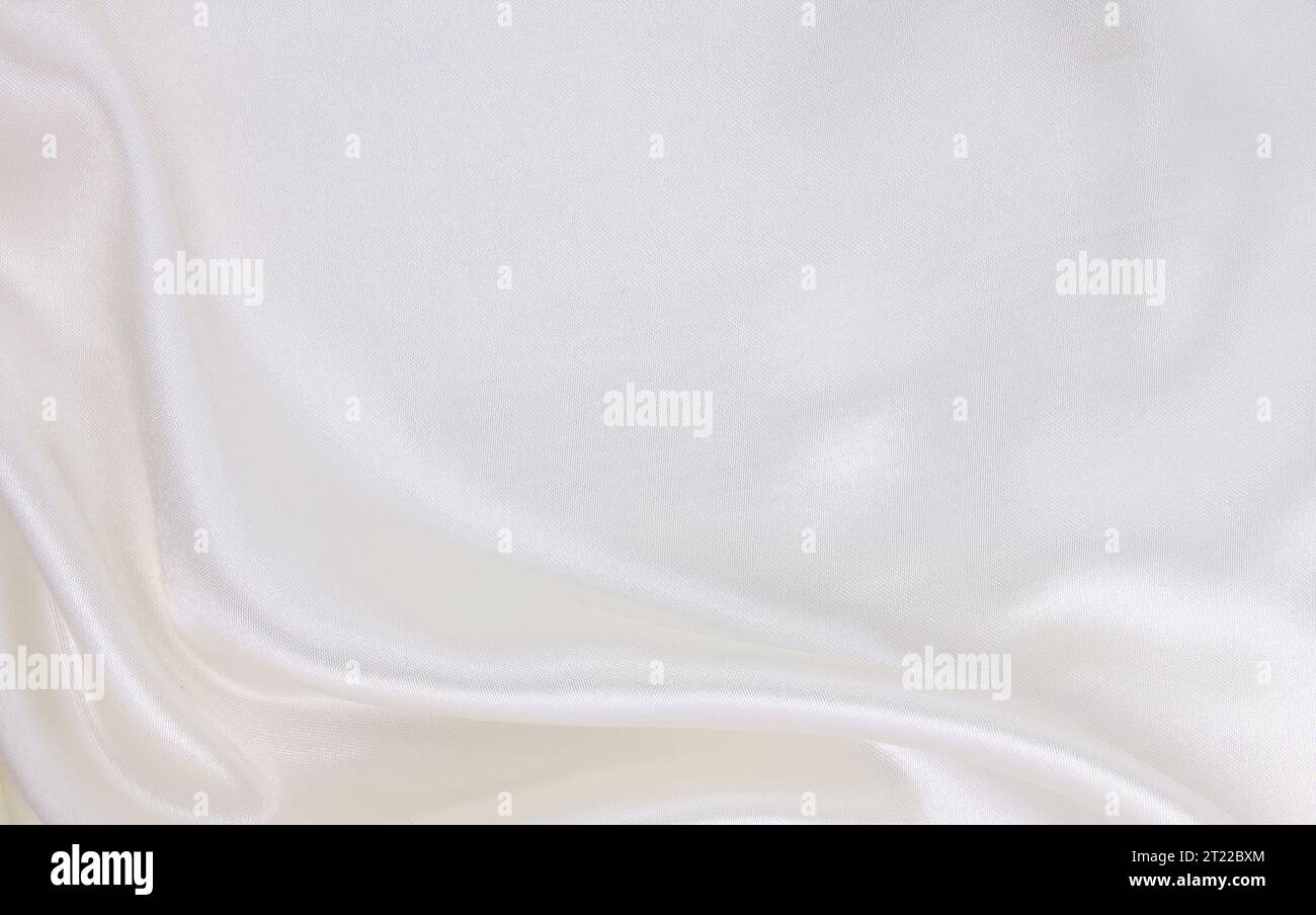 Smooth elegant white silk or satin luxury cloth texture can use as ...