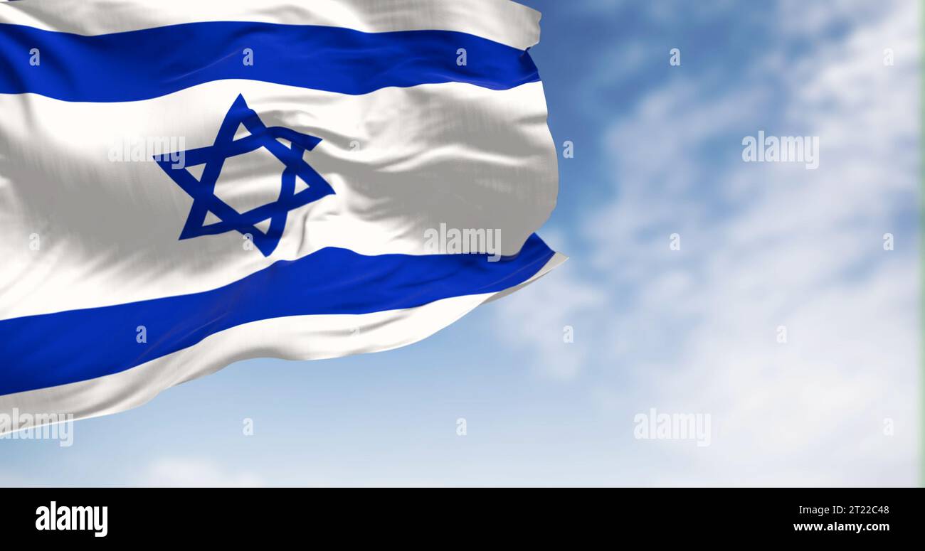 State of Israel national flag waving in the wind on a clear day. Blue ...