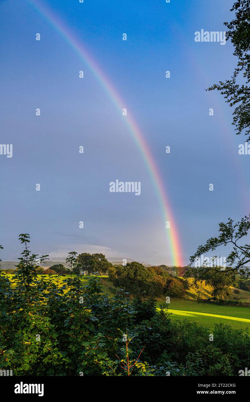 A strong summer rainbow at Irthington, Cumbria, England UK Stock Photo ...
