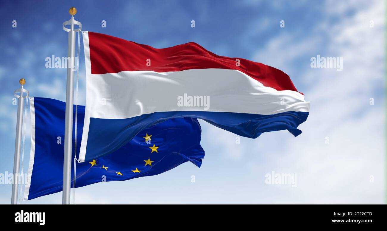 The flags of the Netherlands and the European Union waving in the wind ...