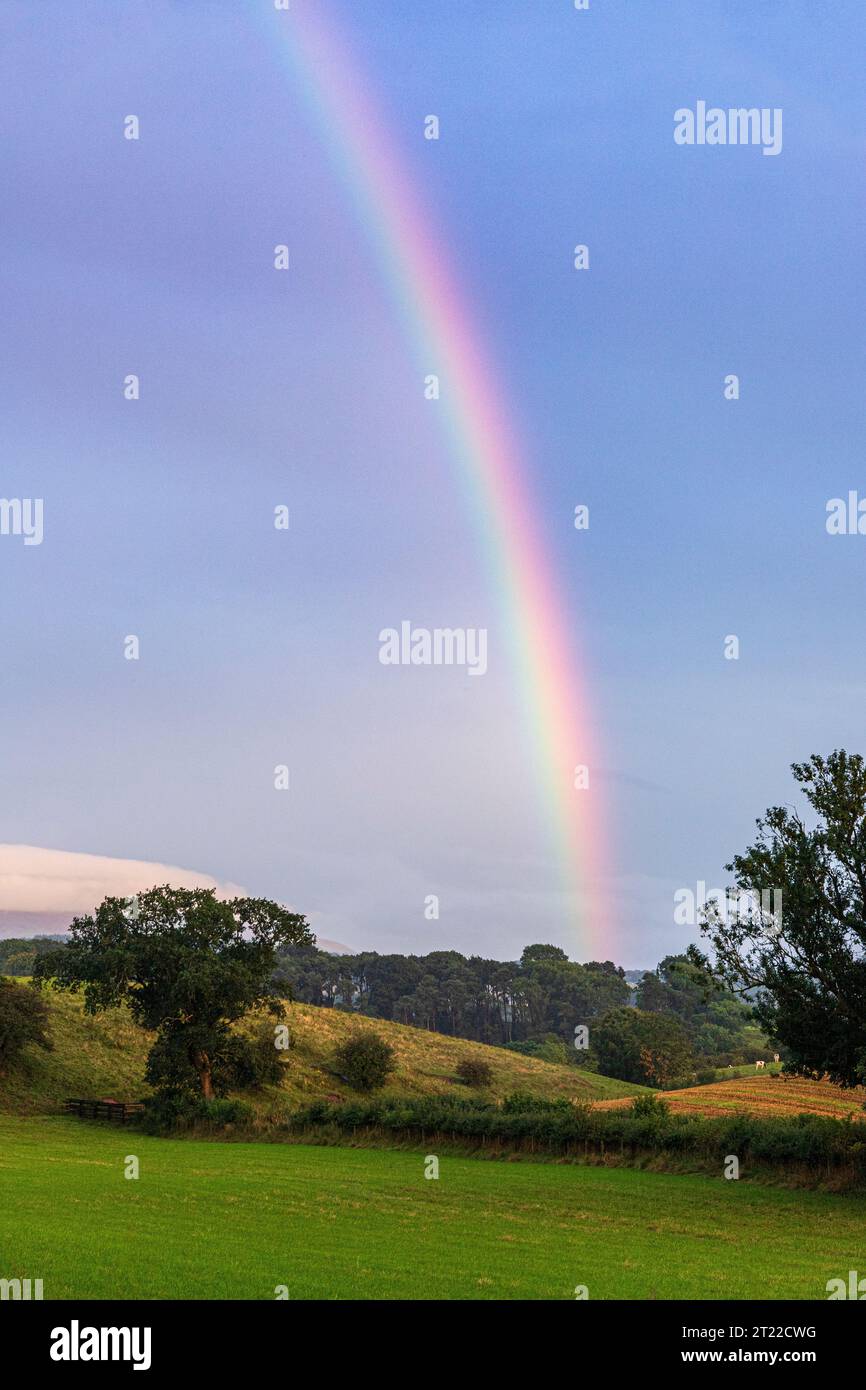 A strong summer rainbow at Irthington, Cumbria, England UK Stock Photo ...
