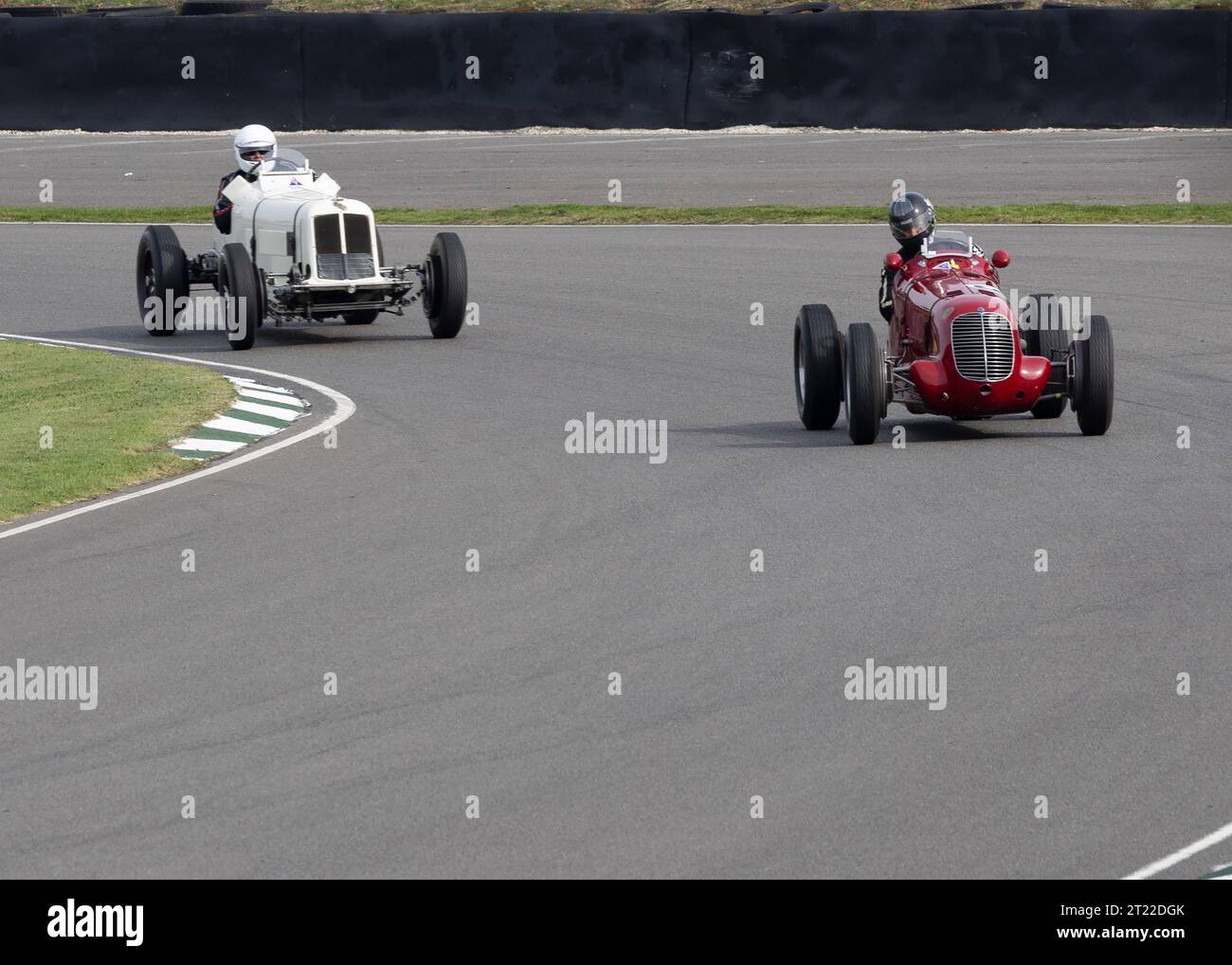 A 1938 Maserati 6CM leads a 1936 ERA B-type R9B racing car at the 2023 ...