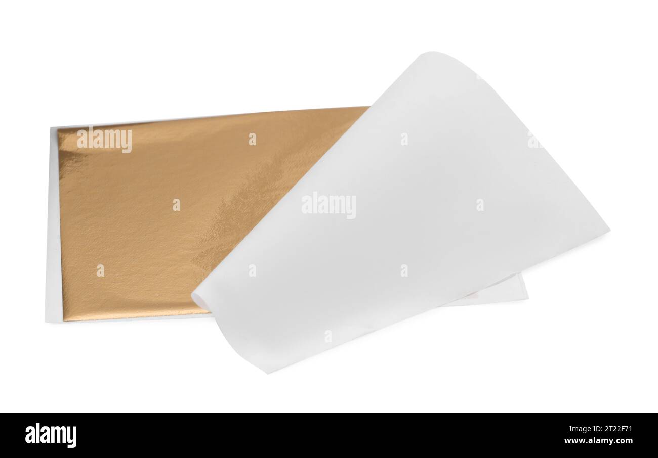 One edible gold leaf sheet isolated on white Stock Photo - Alamy