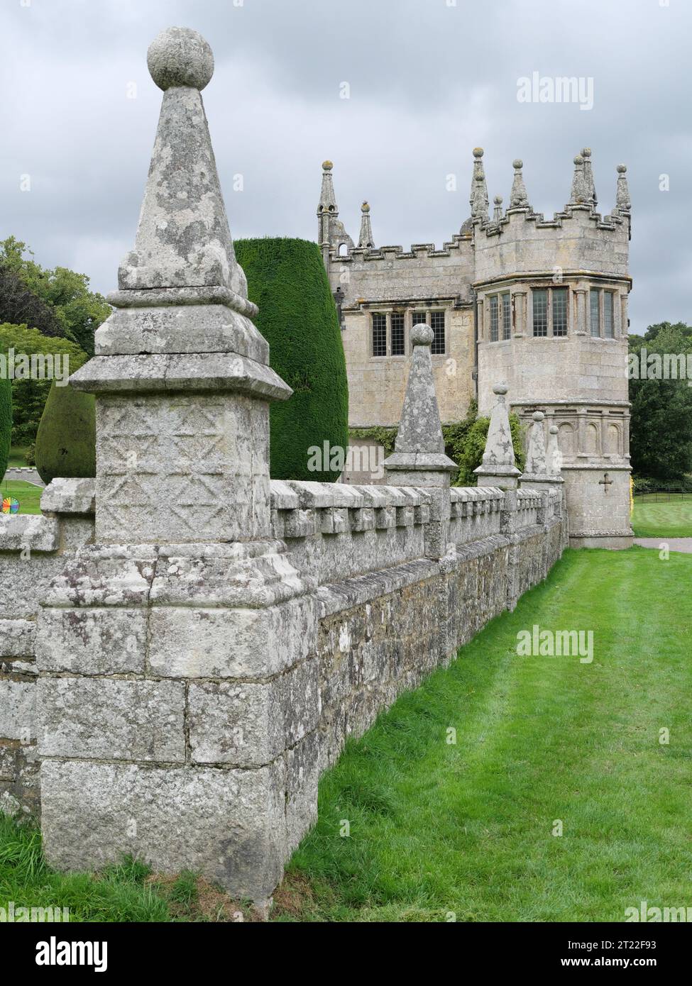 View of gatehouse and surrounding wall of Lanhydrock manor house in ...