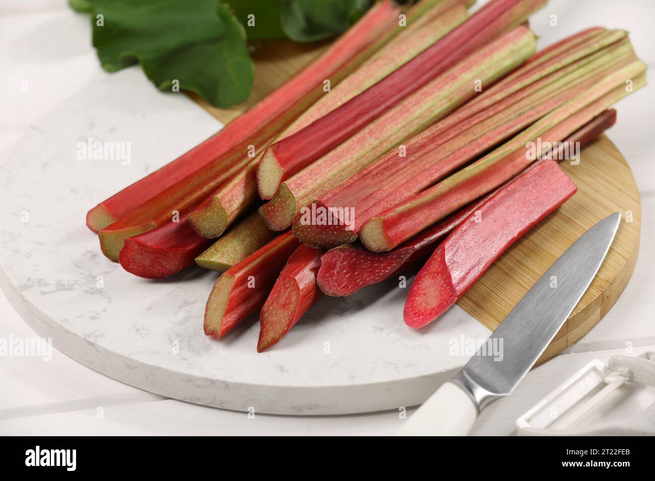 Many cut rhubarb stalks on white table, closeup Stock Photo - Alamy