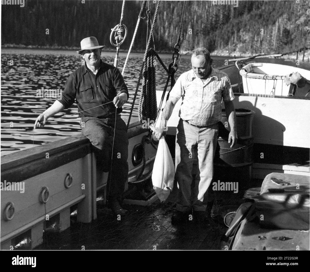 A group fishing at Wildcat Cove, Alaska, catches halibut. The cove is ...