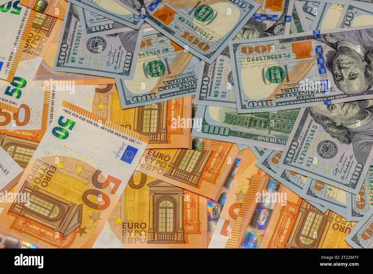 50 euro and 100 dollar bills scattered on the table as a background Stock Photo - Alamy