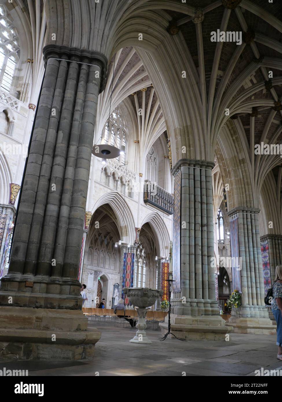 The nave or longitudinal aisle with vault and columns in the gothic ...