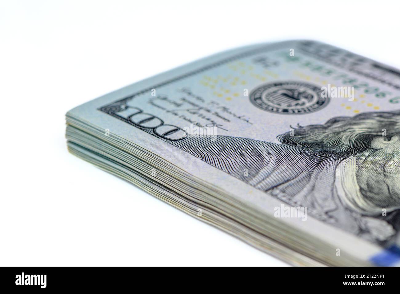 a stack of 100 dollar bills on a white background studio shooting 2 ...