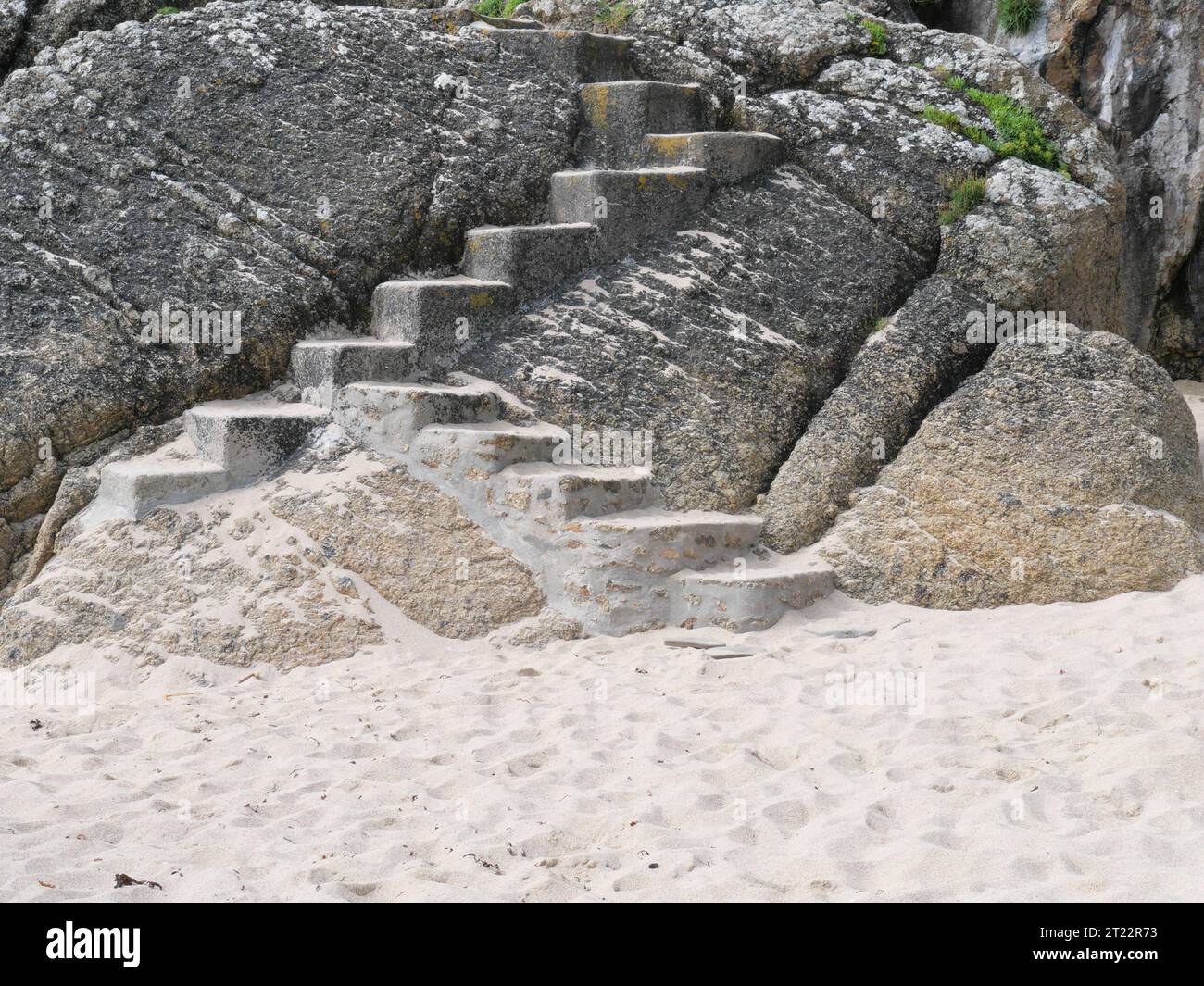 Steps carved into the rock and concrete on the most beautiful beach in ...
