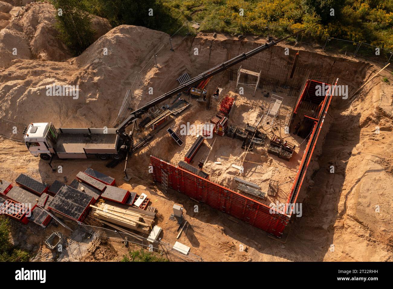 Drone photography of small construction site and workers building a ...