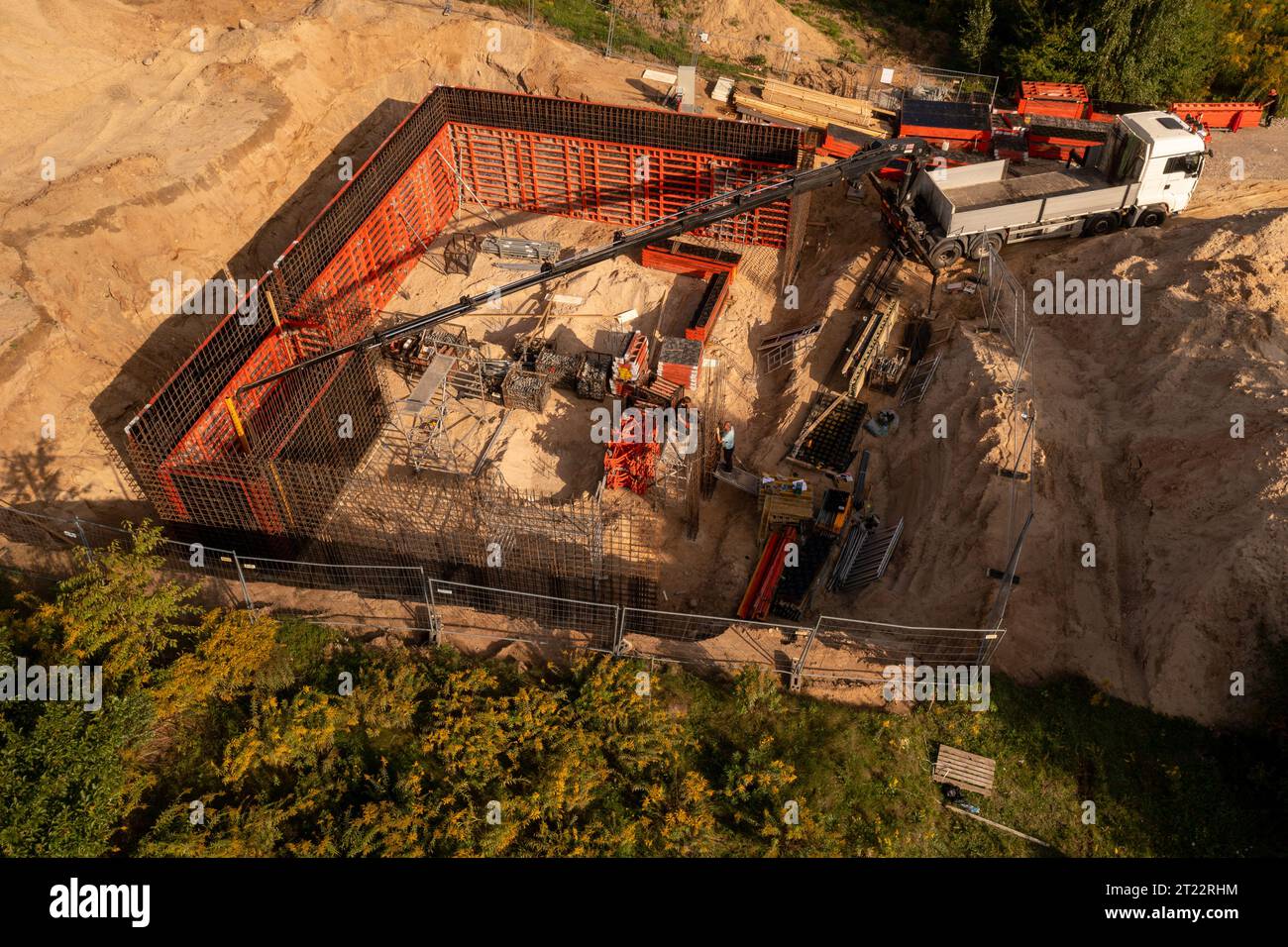 Drone photography of small construction site and workers building a ...
