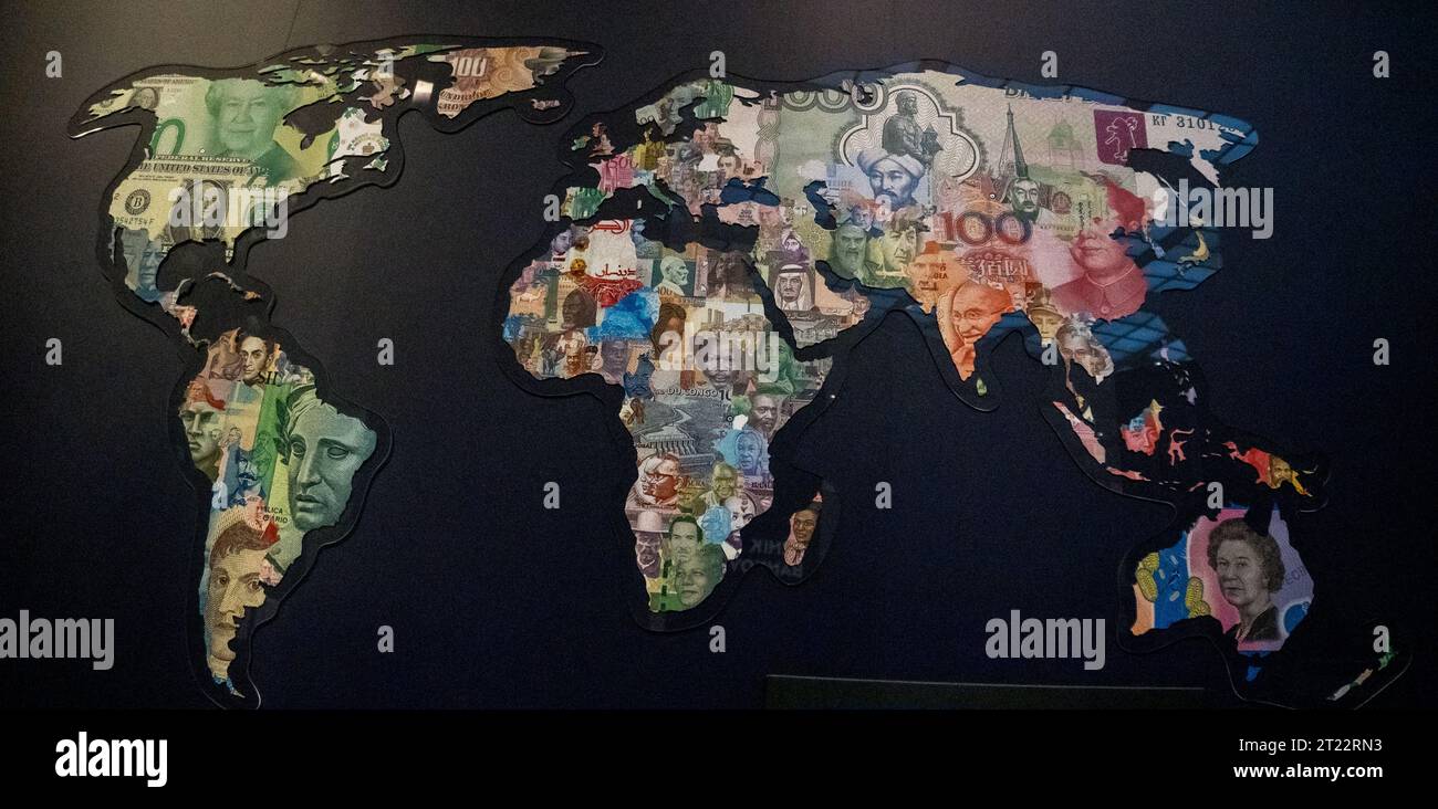 World map with continents made from money of different countries on ...
