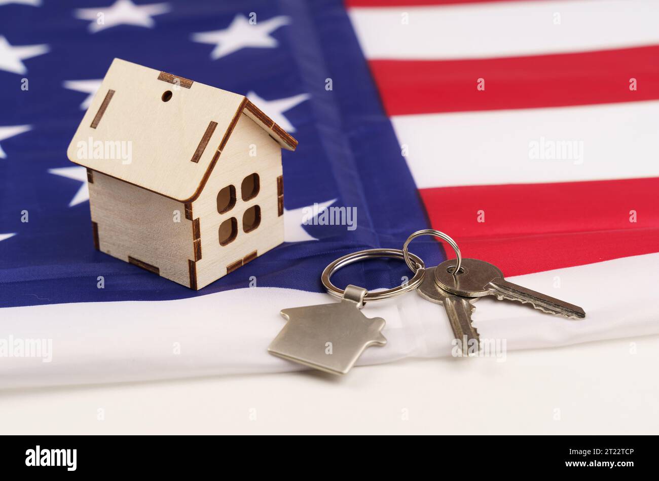 USA flag and key from home as symbol of VA loan on the desk Stock Photo ...