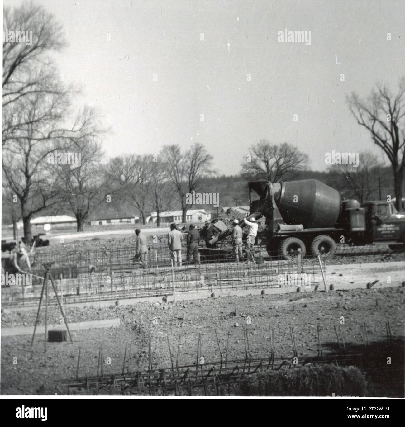 Photograph showing construction of a fish hatchery raceway completed ...