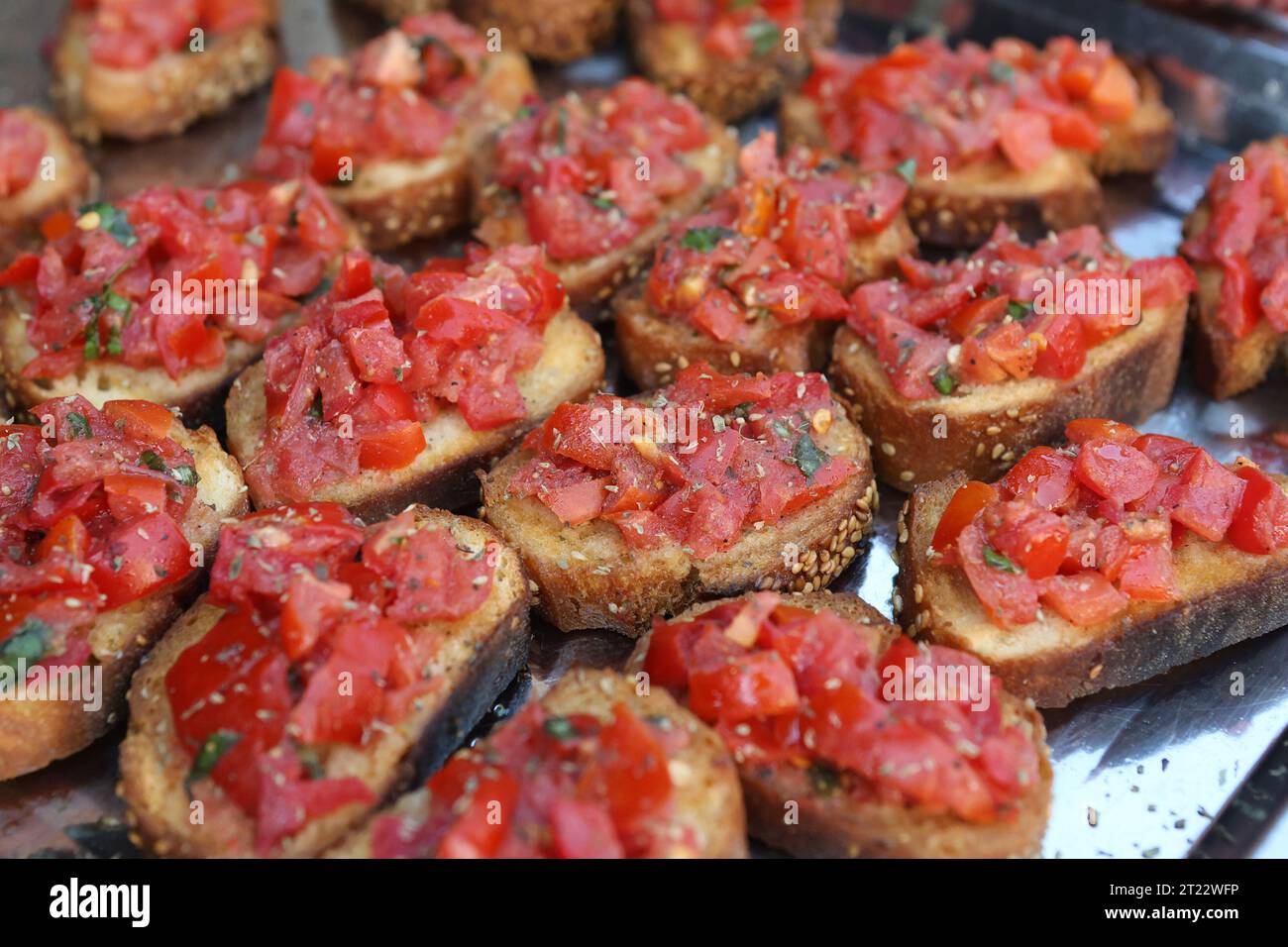 Toasted bread topped with tomatoes on display at a cafe in the Ballaro ...