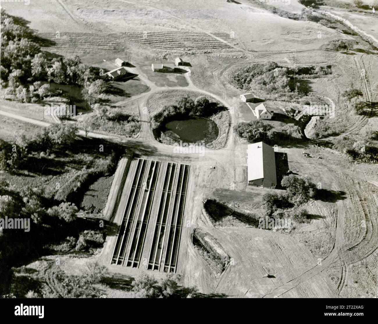 This aerial view shows the layout of a fish hatchery, including its ...