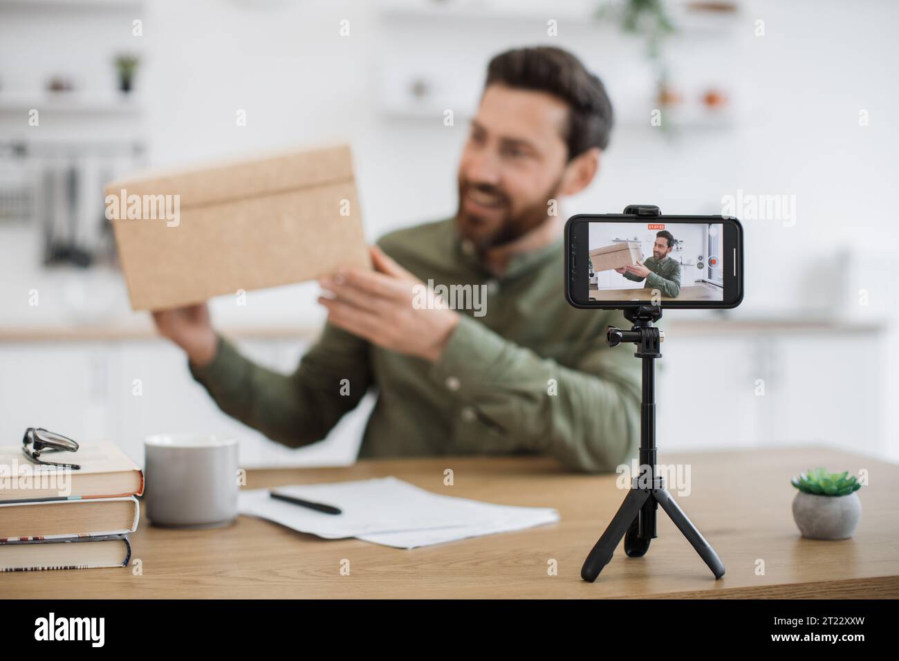 Caucasian bearded man making surprised facial expression while ...