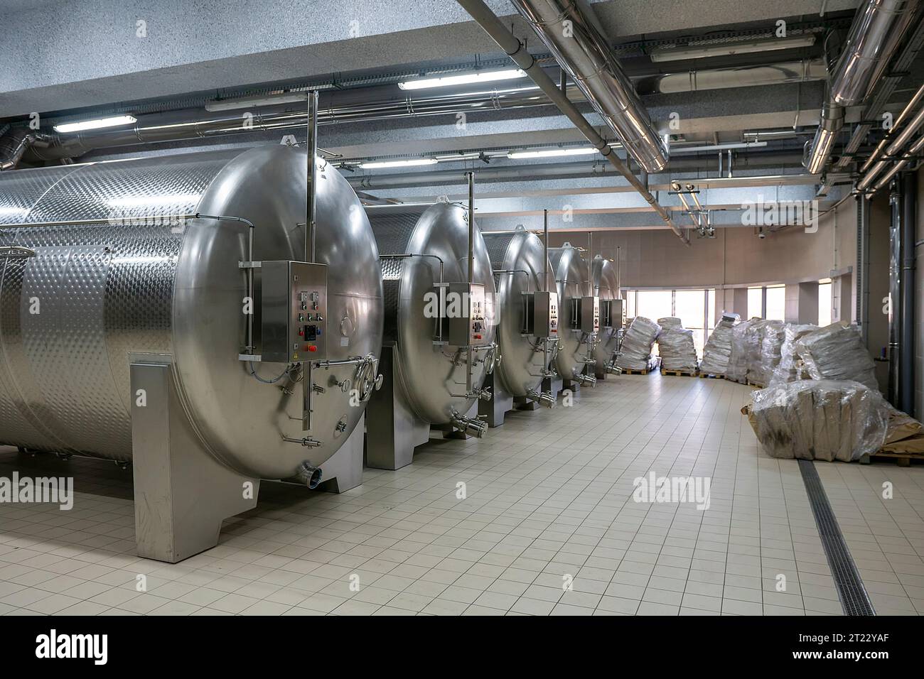 Large modern wine barrels at the winery, the concept of a large factory ...