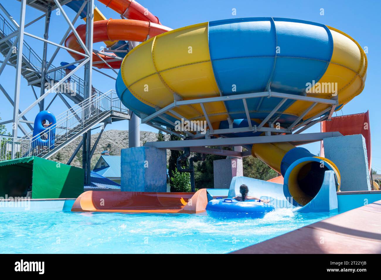 Playground with a swimming pool. water Park for children. colorful ...