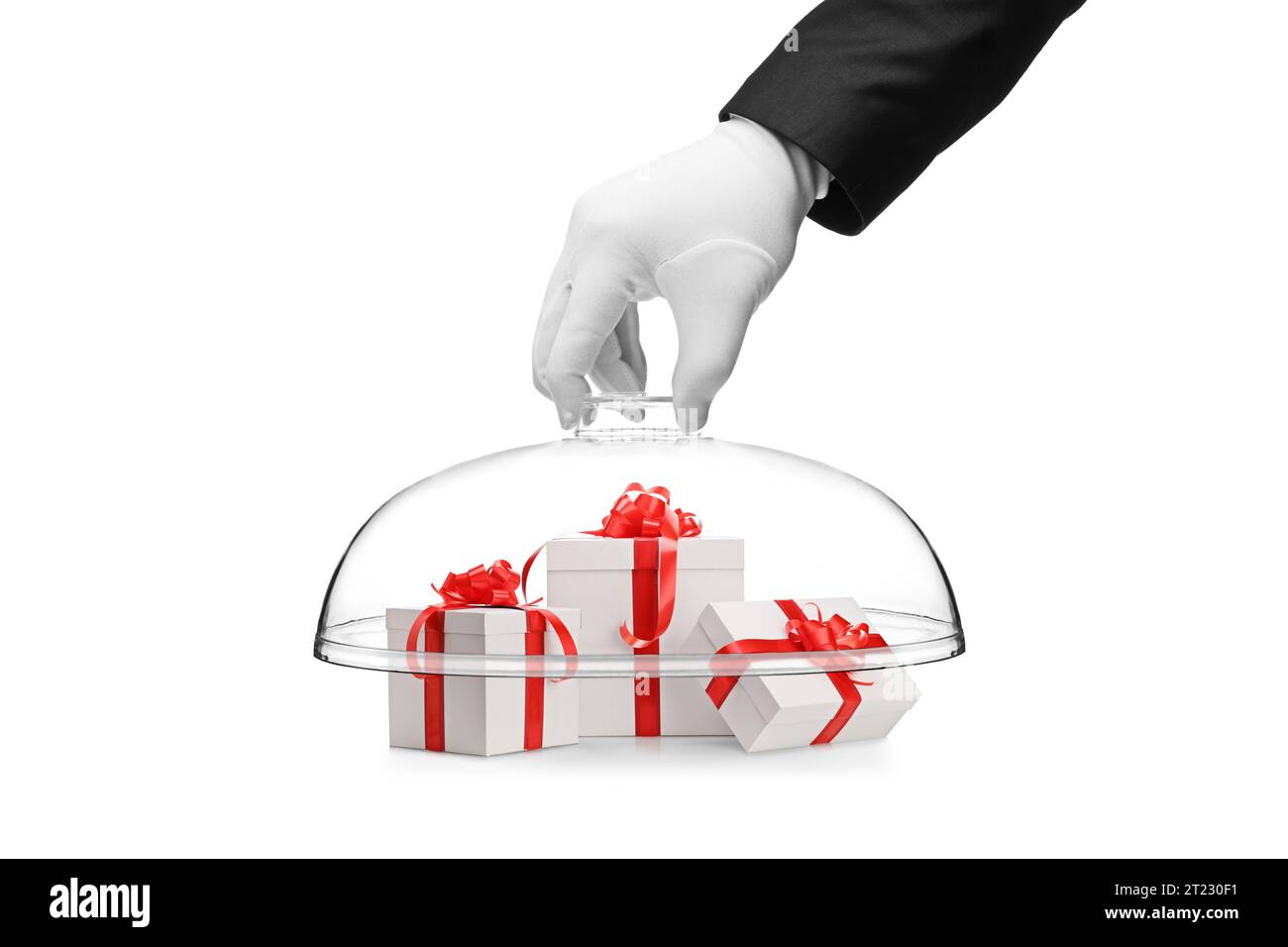 A gloved hand covering gift boxes with a glass dome isolated on white ...