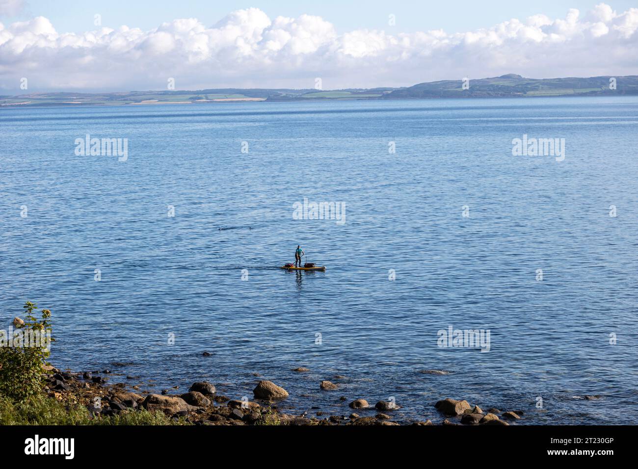 Woman water paddling Isle Of Arran, Firth of Clyde, Scotland, UK Stock ...