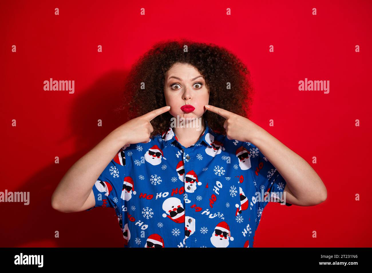 Photo portrait of lovely young lady fingers point inflated cheeks wear ...