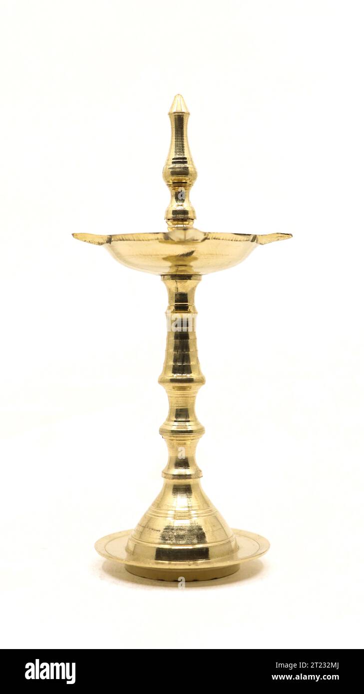 a unique, antique oil wick lamp or diya or vilakku made of brass used ...