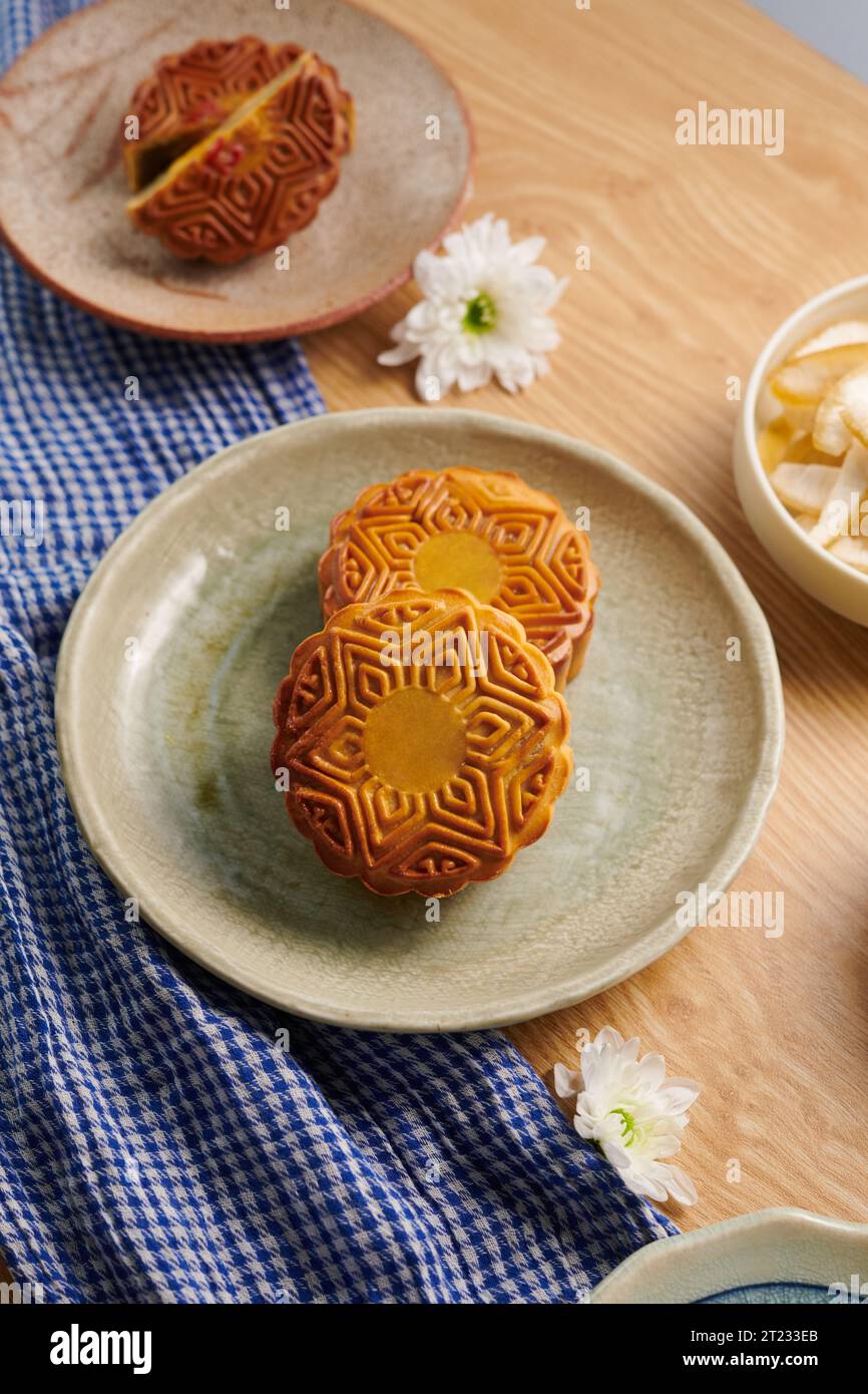 Traditional moon cakes with various fillings on table served for mid ...