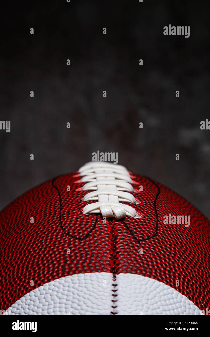 Extreme close-up of the stringing of a brown american football ball ...