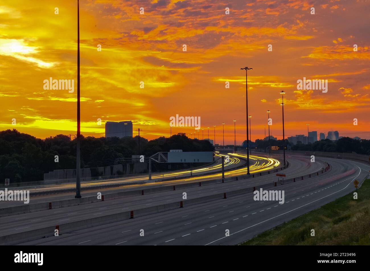 Sunrise or dawn sky on Ontario Highway 401. The speedway is officially ...