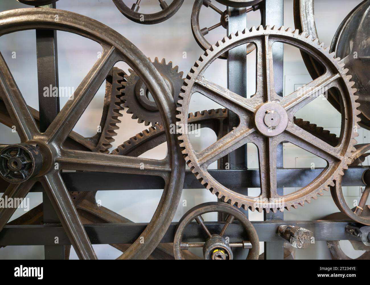 Antique iron wheel gear system Stock Photo - Alamy