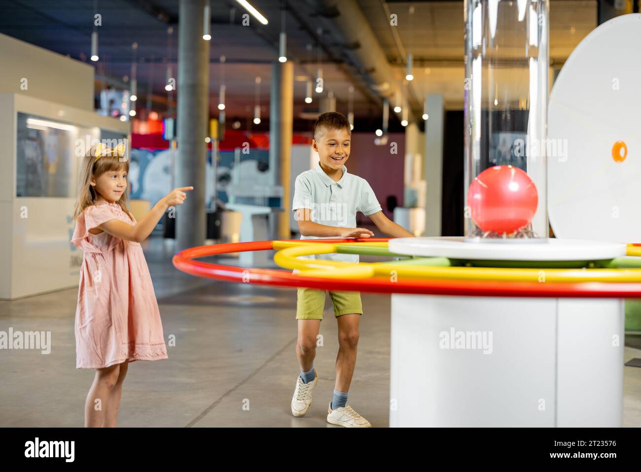 Little boy and girl visit a science museum Stock Photo - Alamy