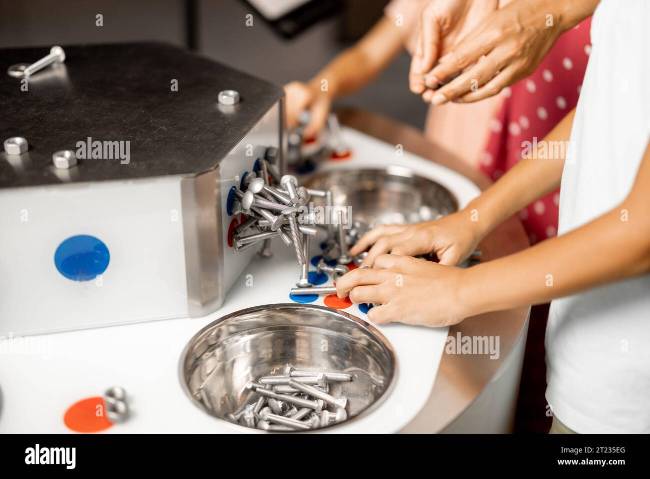 Kids play with magnets in science museum Stock Photo - Alamy