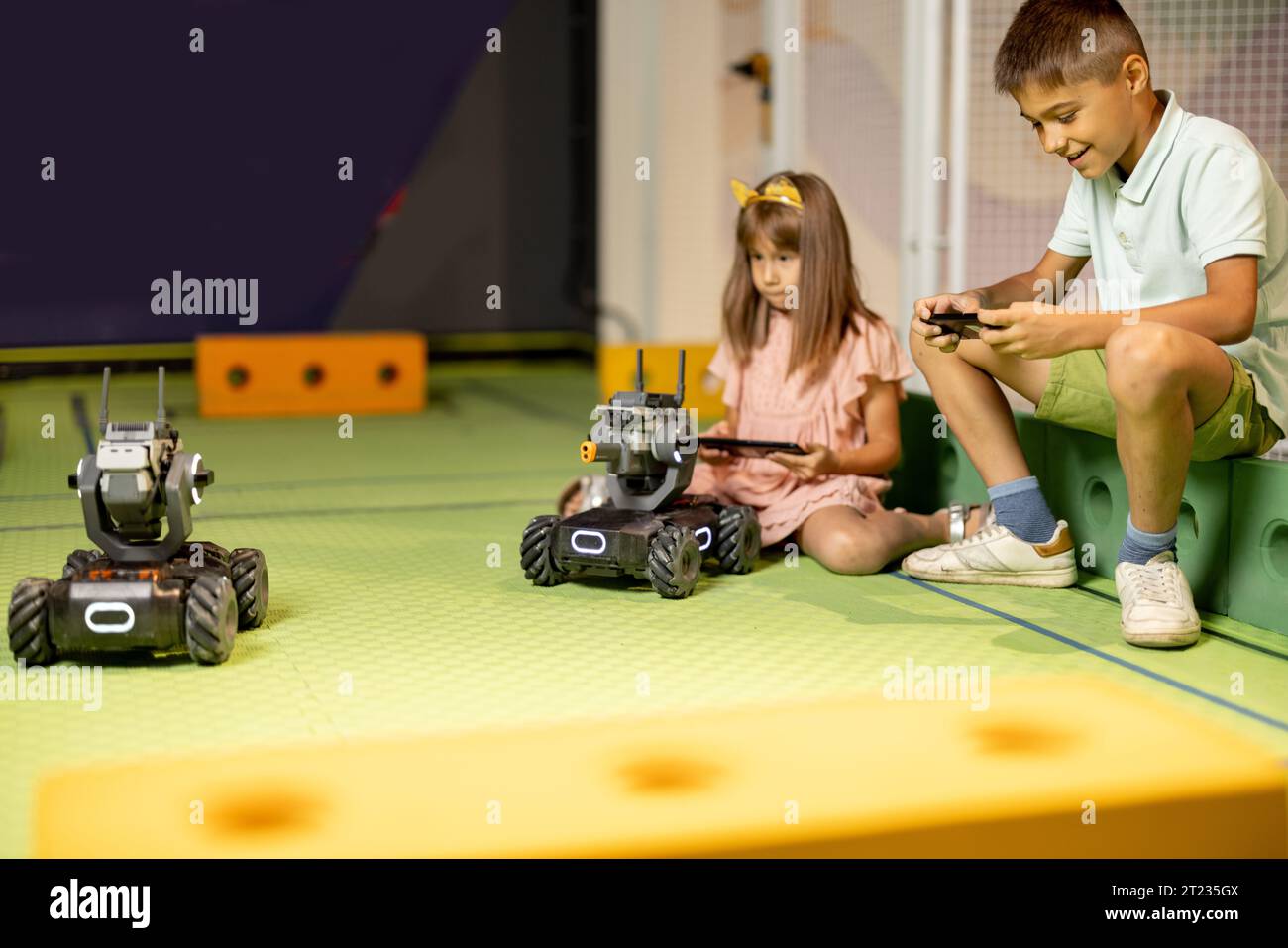 Kids playing with robotic cars Stock Photo - Alamy