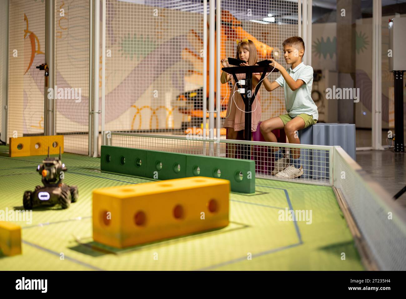 Kids playing with robotic cars Stock Photo - Alamy