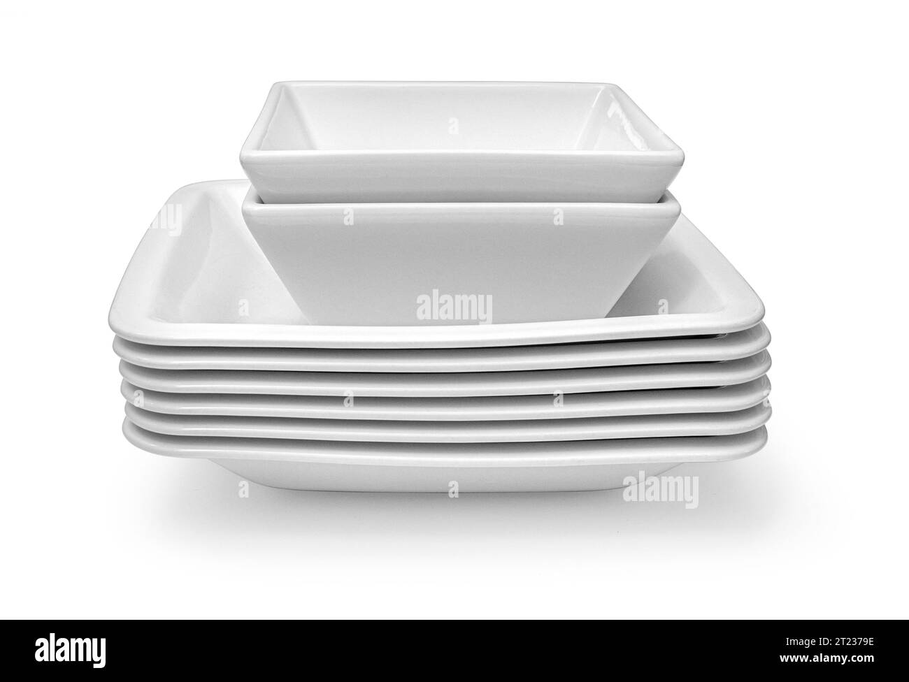 a stack of square white plates isolated on white background with ...