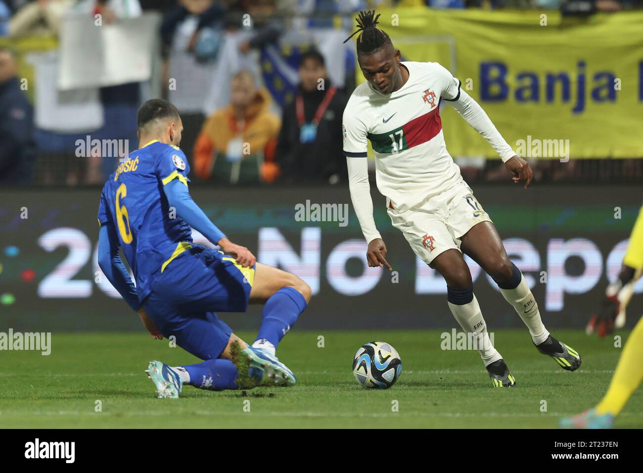 Bosnia's Adrian Leon Barisic, left, challenges for the ball with ...