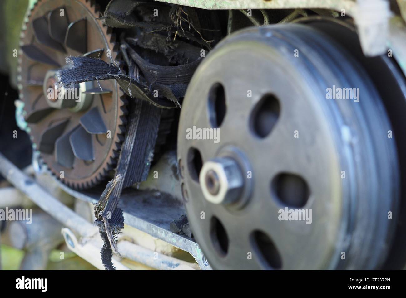 Close-up. Torn damaged variable transmission belt on the scooter Stock ...