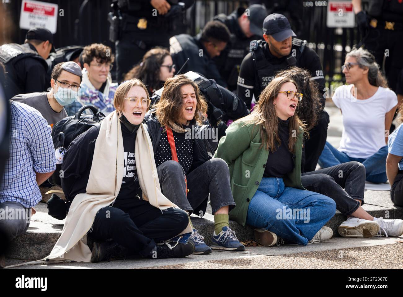 Protestors against IsraelÕs planned incursion into Gaza are handcuffed ...