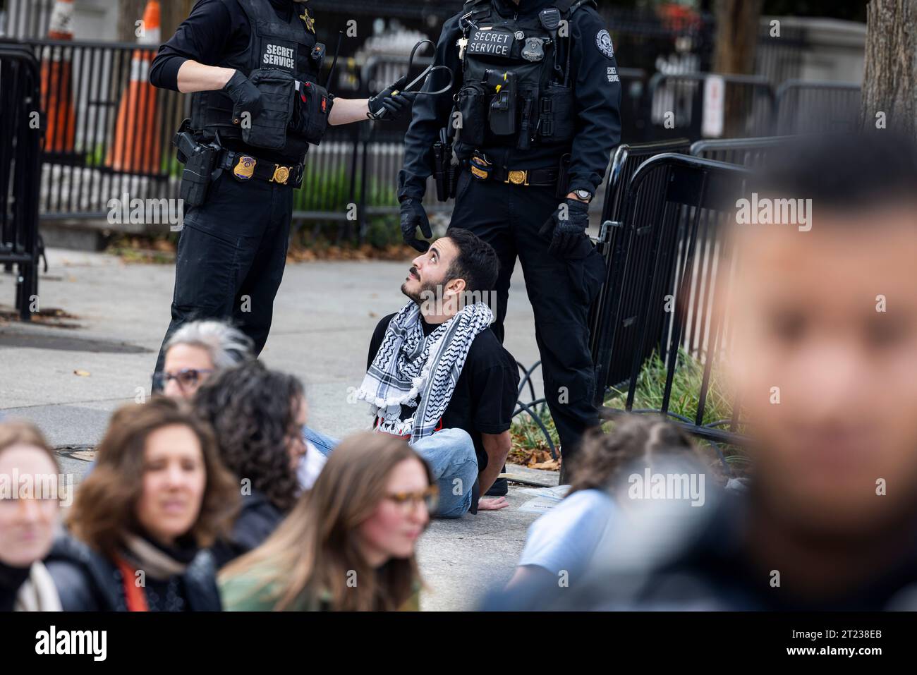 Protestors against IsraelÕs planned incursion into Gaza are handcuffed ...