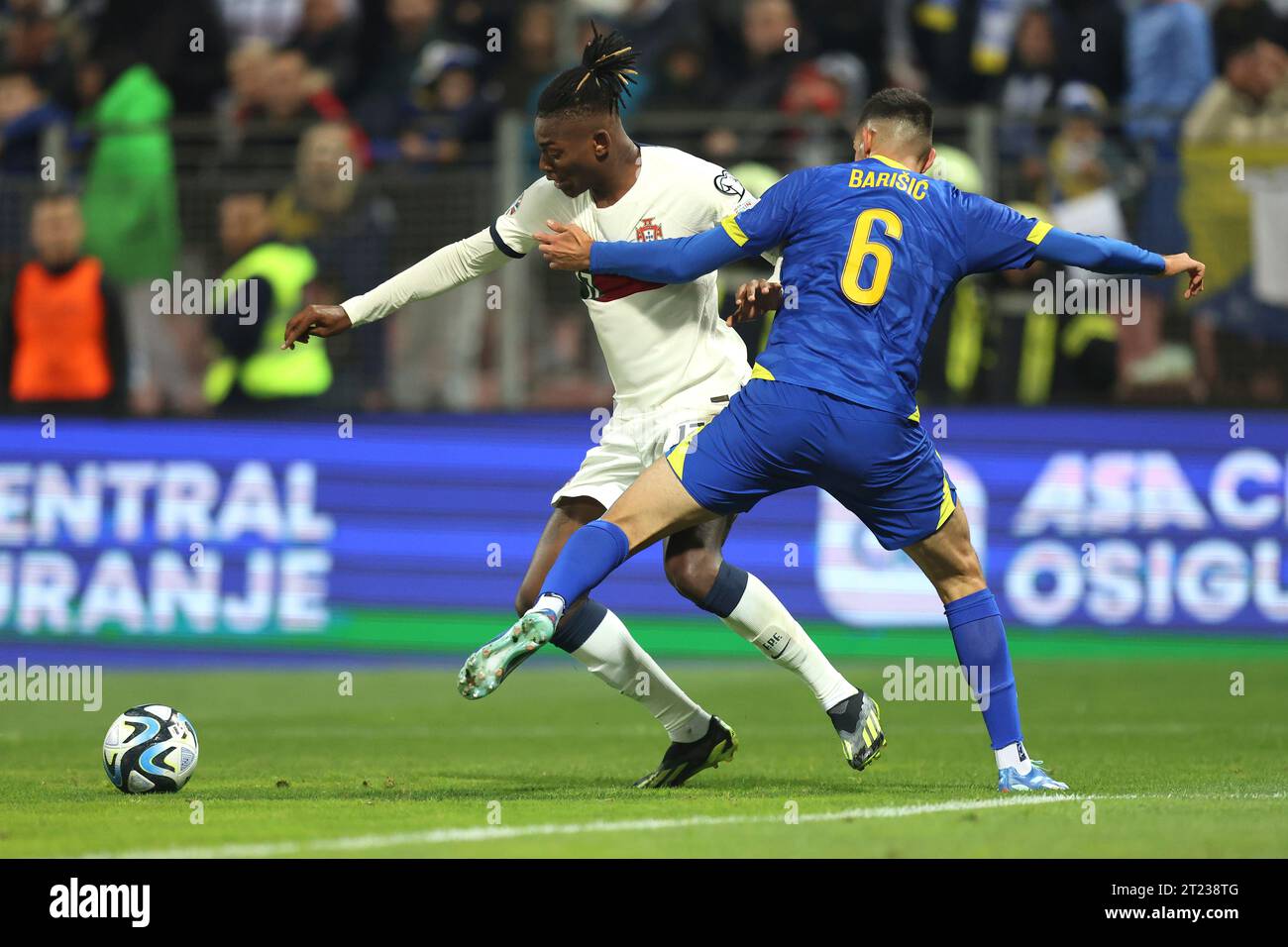 Bosnia's Adrian Leon Barisic, right, challenges for the ball with ...