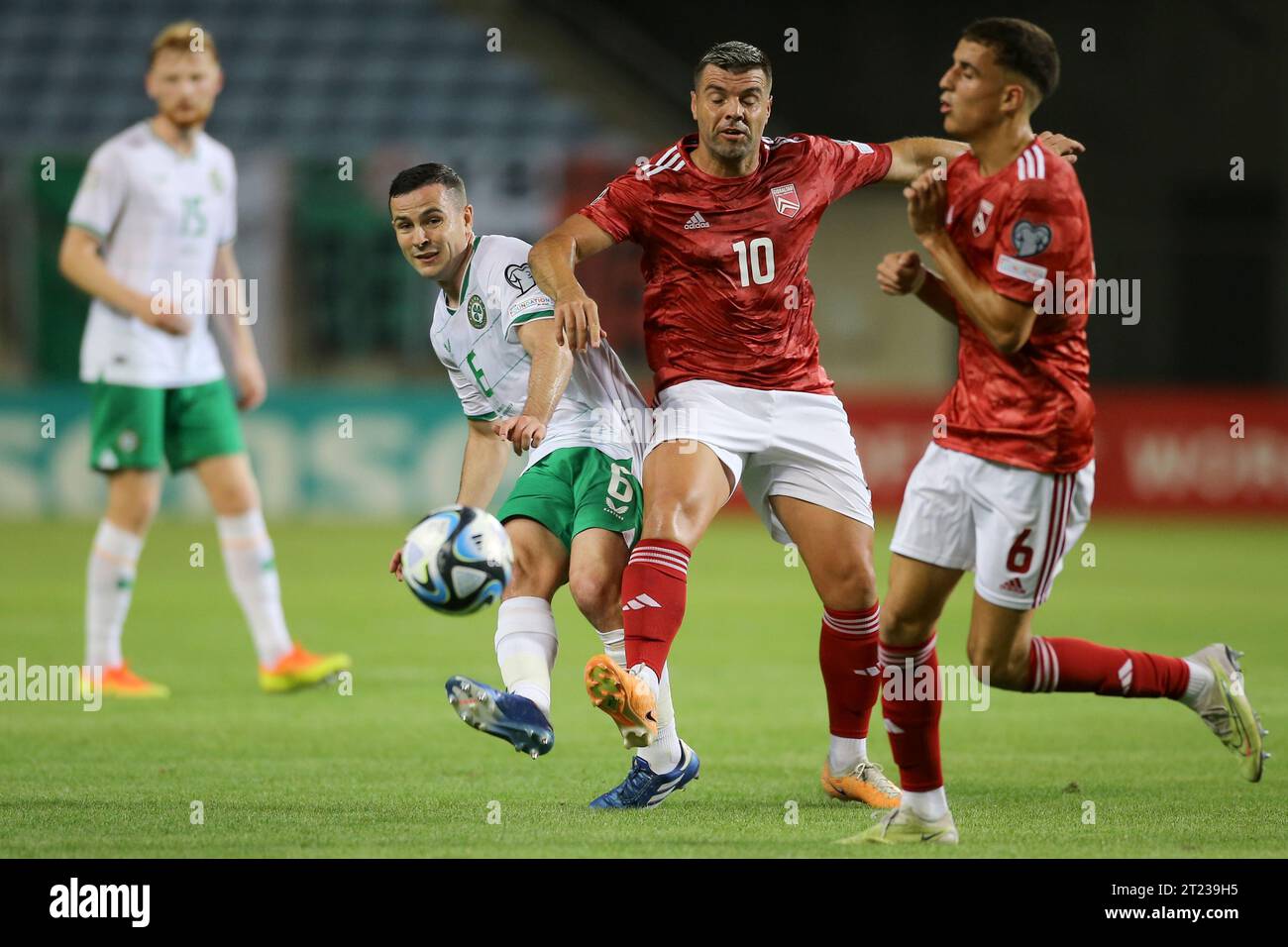 Ireland's Josh Cullen, 2nd left, passes the ball past Gibraltar's Liam ...