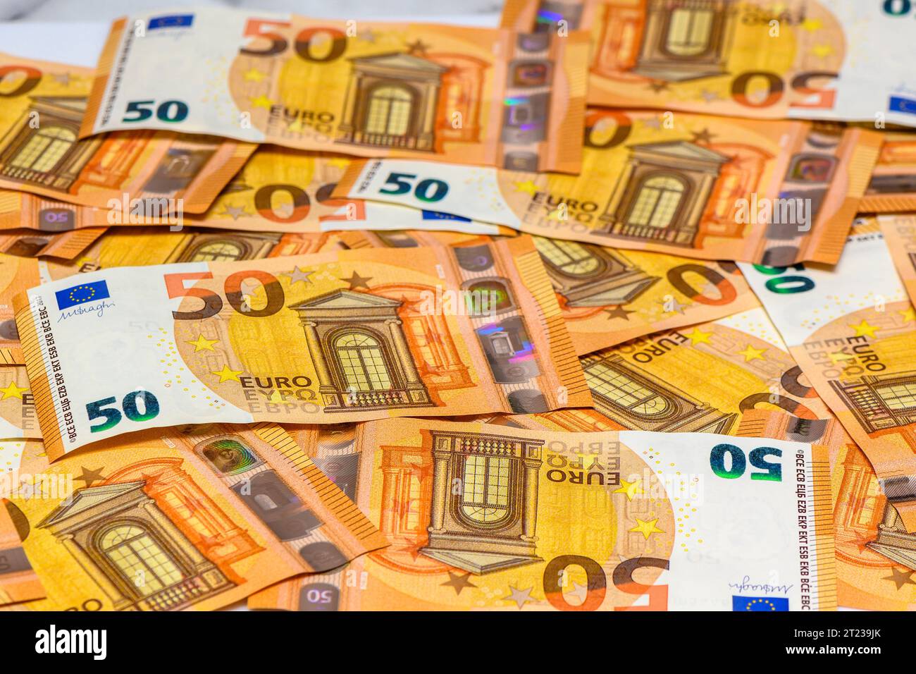 50 euro bills scattered on the table as a background 3 Stock Photo - Alamy